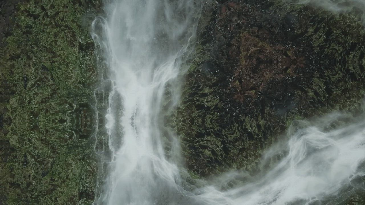 Waterfall seen from above in the forest - Free Stock Video