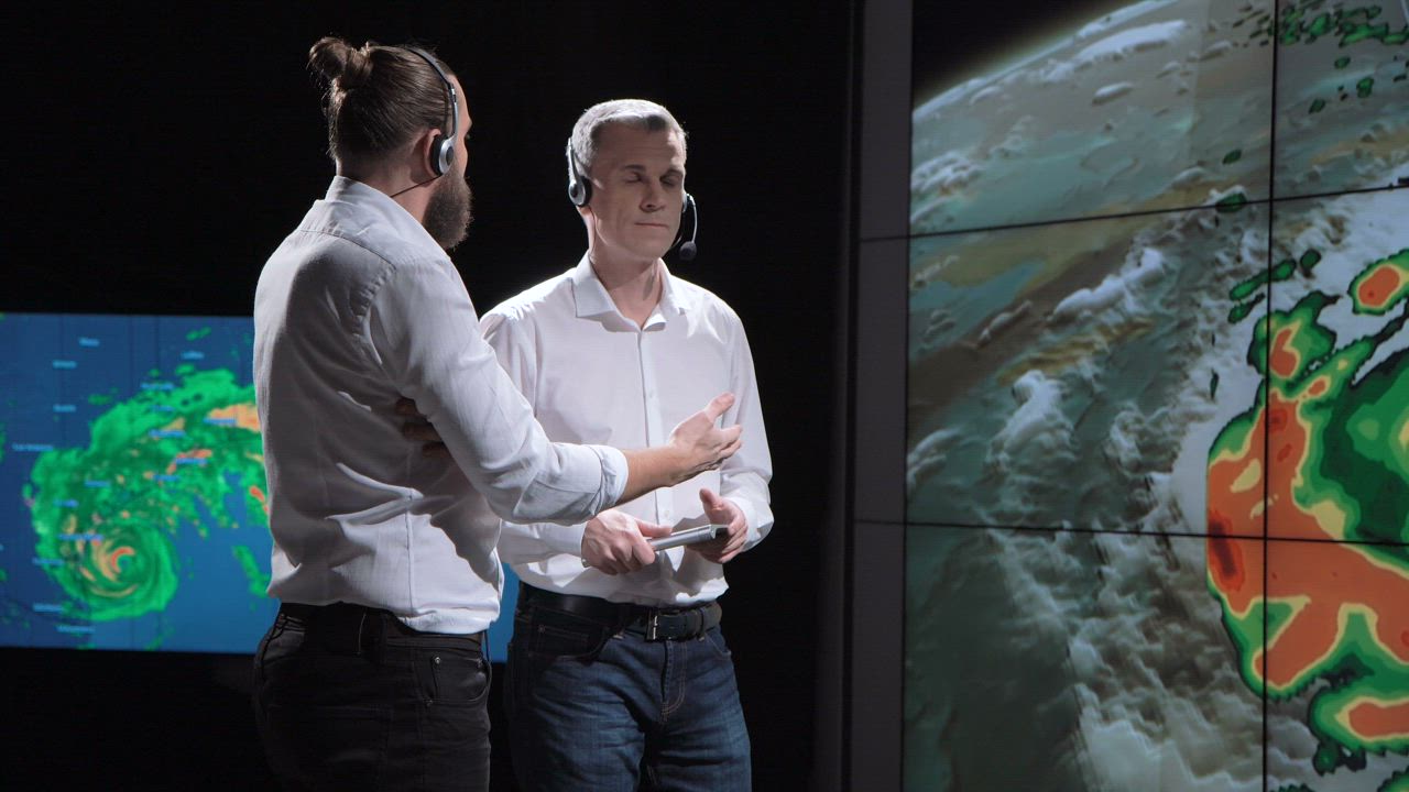 Scientist discussing hurricane and weather - Free Stock Video