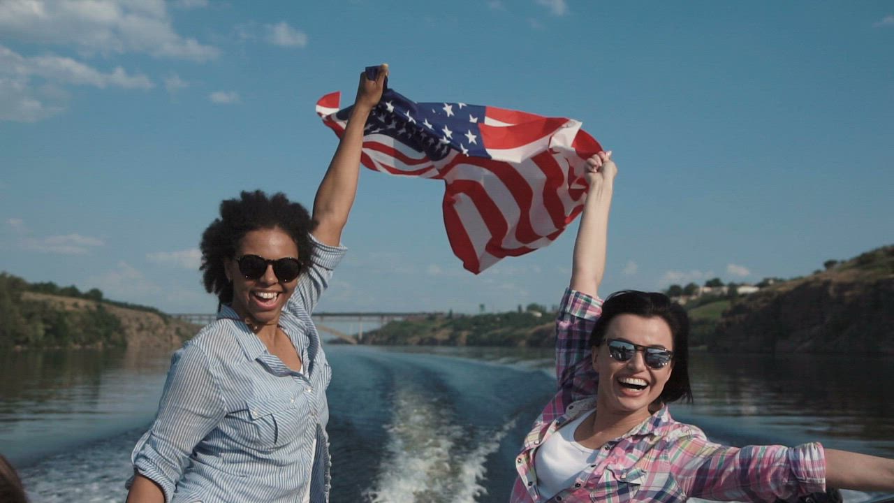 Laughing girls riding in a speedboat - Free Stock Video
