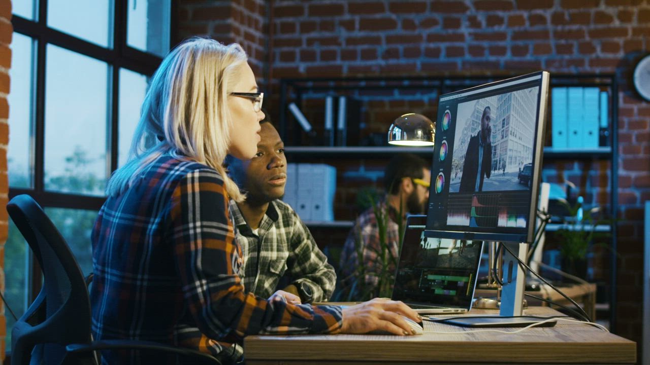 Working on video editing in the office - Free Stock Video