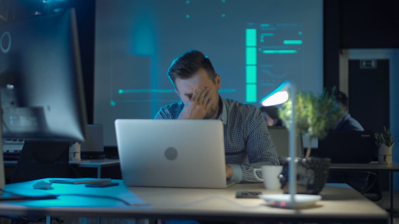 Man fed up with work in the office drinks coffee - Free Stock Video