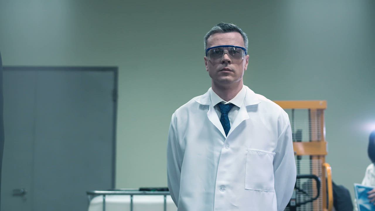 Scientist walking in the lab - Free Stock Video