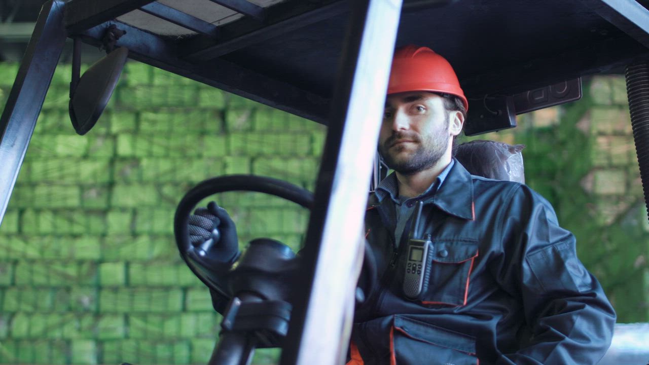 Loading vehicle operator smiling to the camera - Free Stock Video