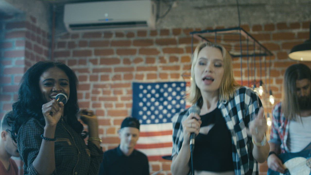 Women singing with band - Free Stock Video