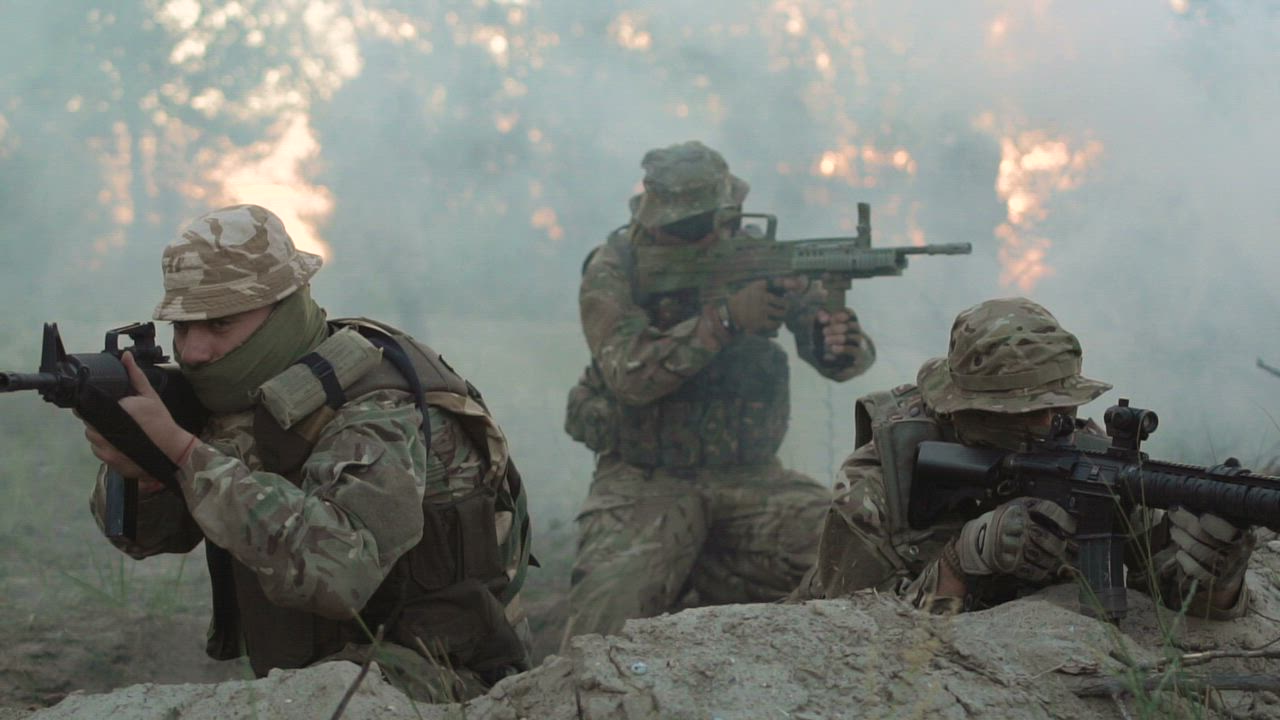 Soldiers in the middle of a war zone - Free Stock Video