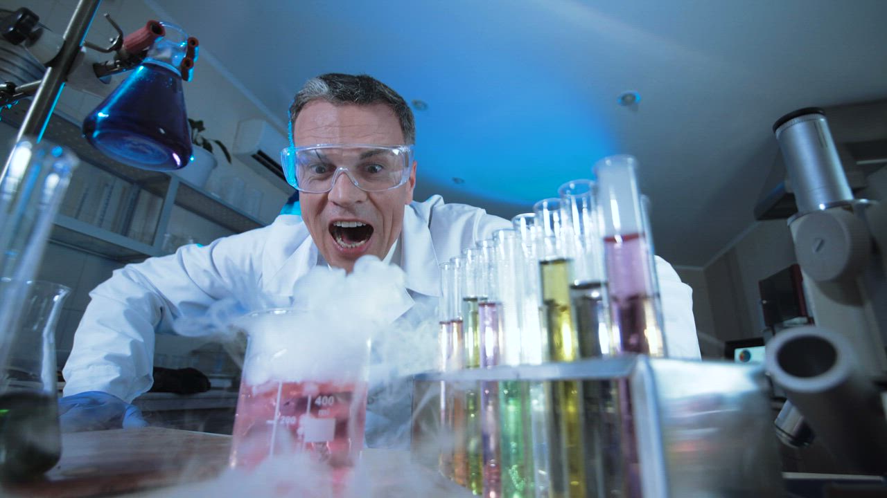 A mad scientist watching chemical reaction - Free Stock Video