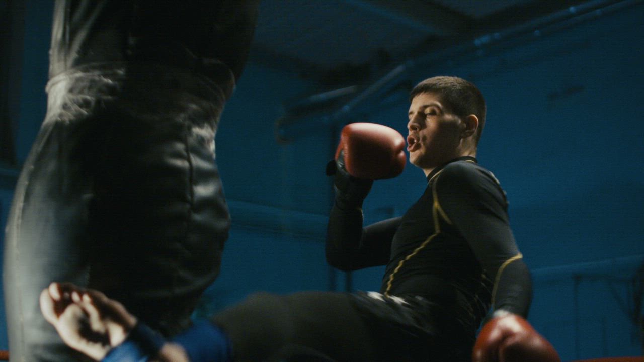 A man hitting the punching back in the gym - Free Stock Video