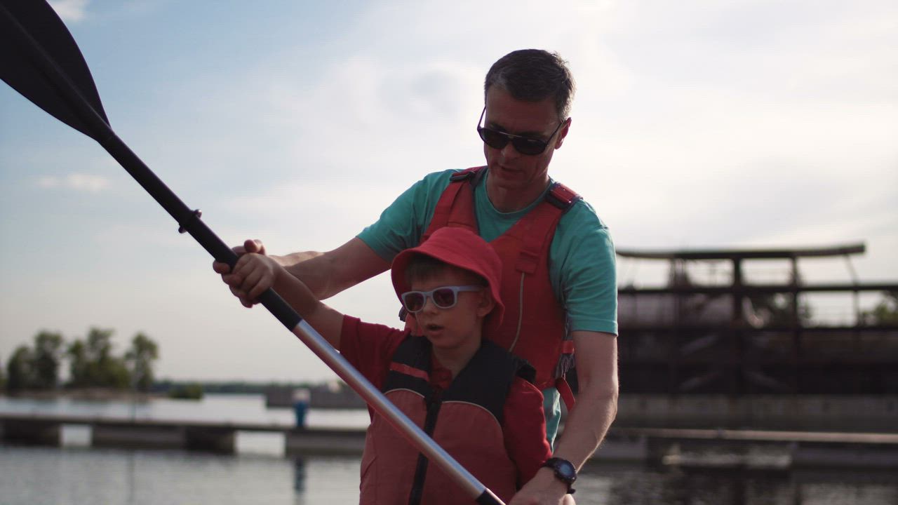 Teaching how to row in a kayak - Free Stock Video