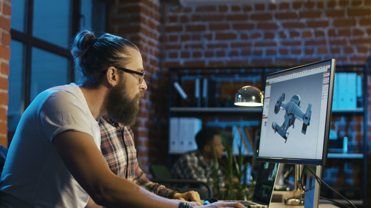 Coworkers working on a video game model - Free Stock Video