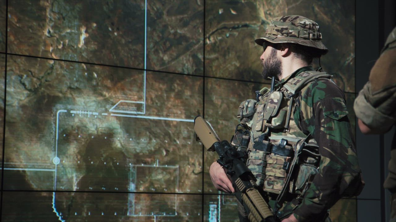 Soldier watching a missile launch on the screen - Free Stock Video