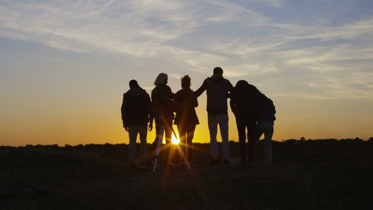 Group of friends watching the sunset together - Free Stock Video