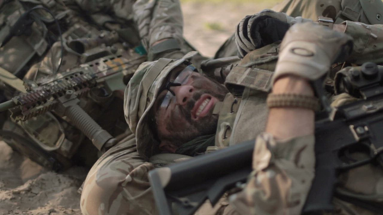 Saving a wounded soldier in the battlefield - Free Stock Video