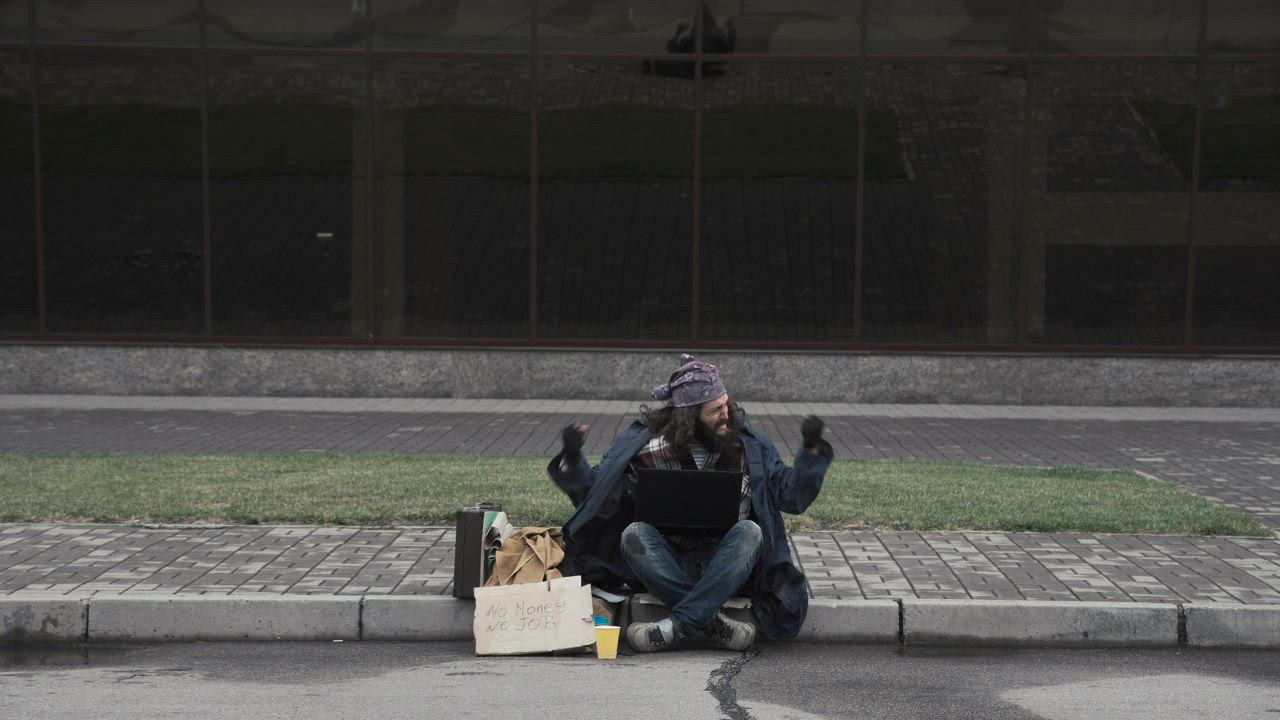 Homeless getting happy news then dances - Free Stock Video