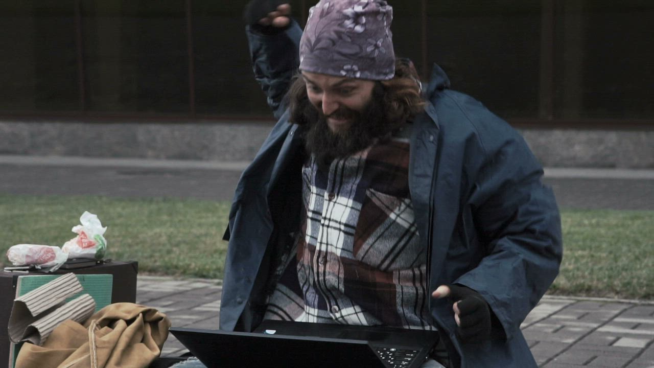 Homeless gets good news on the computer - Free Stock Video