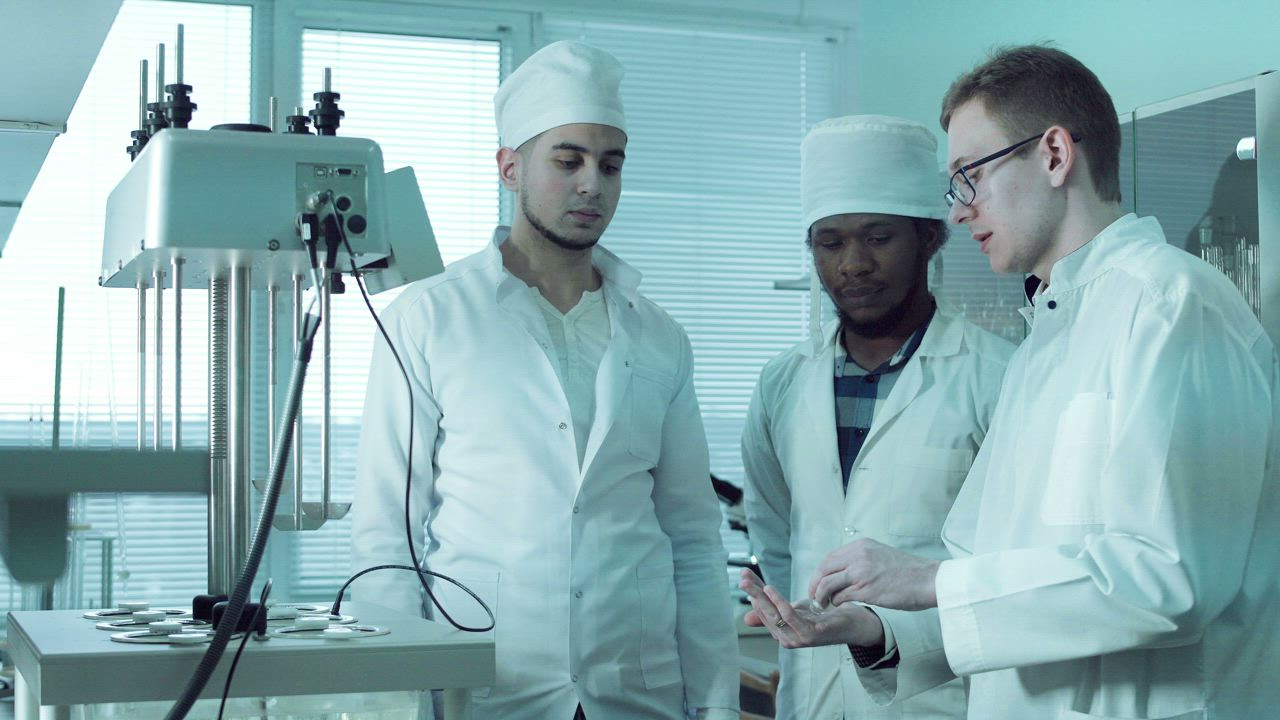 Professor showing students a lab procedure - Free Stock Video
