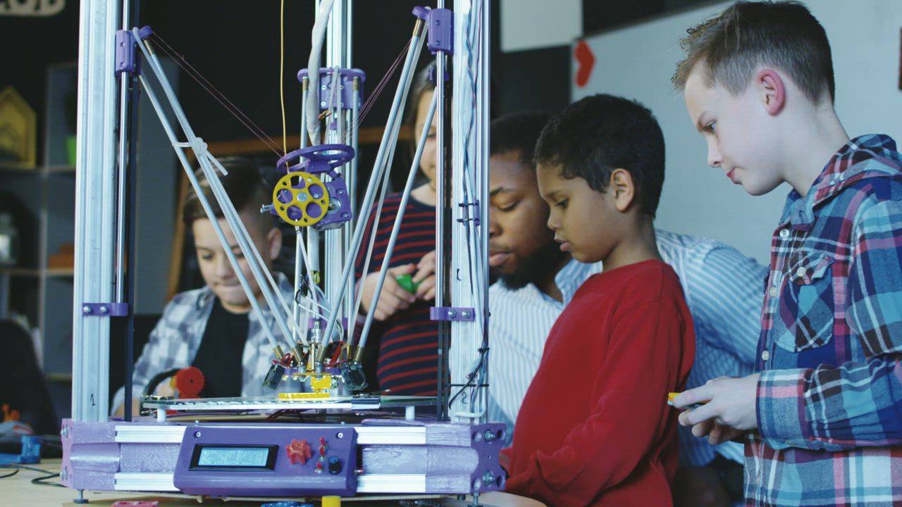 3-D printer in action in kids classroom - Free Stock Video
