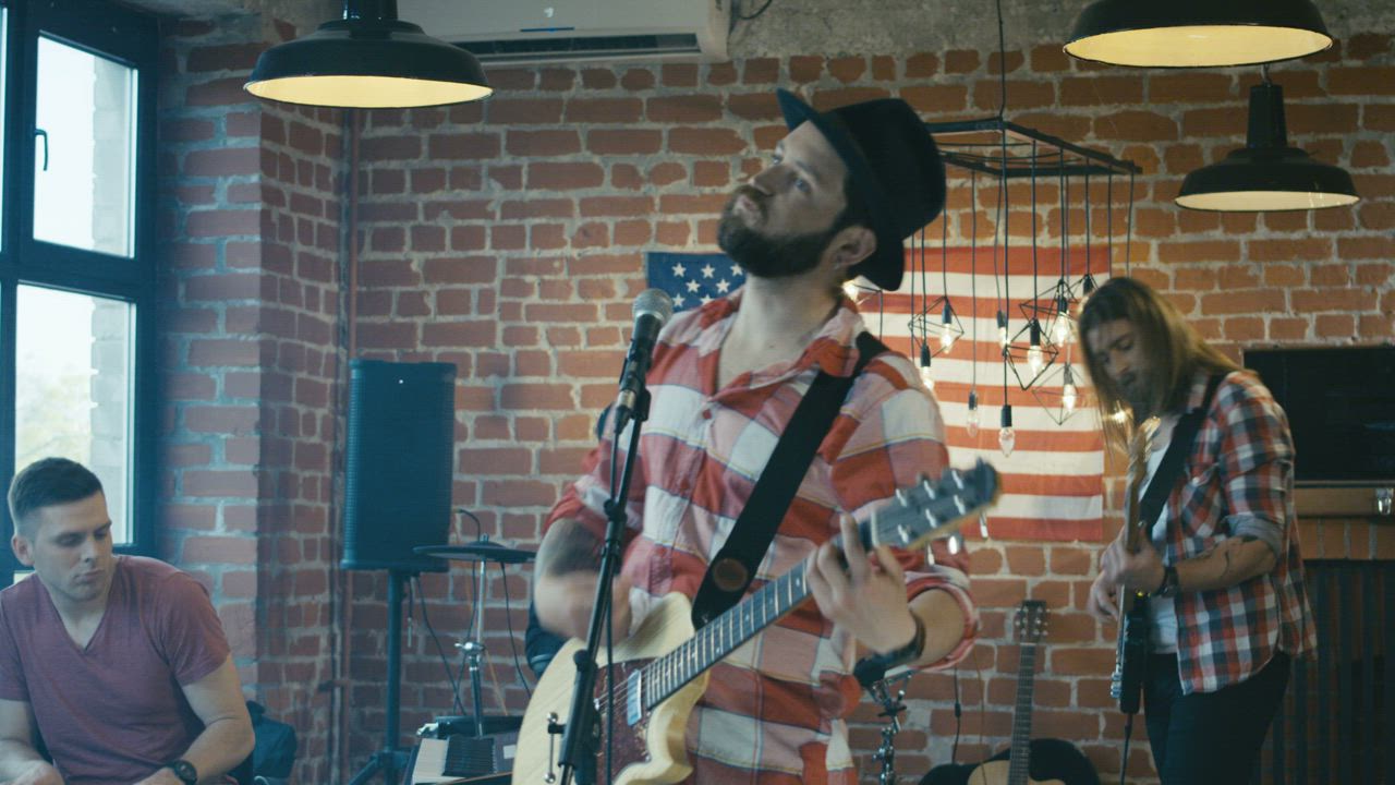 A musical band having an argument - Free Stock Video