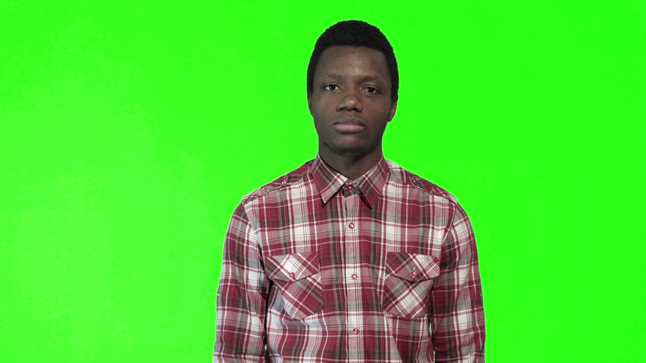 Thoughtful man on green screen - Free Stock Video