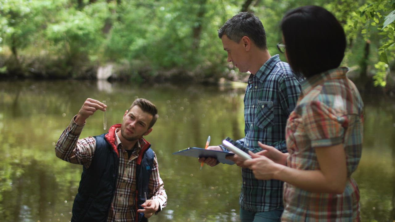 Researchers collecting water samples from the lake - Free Stock Video