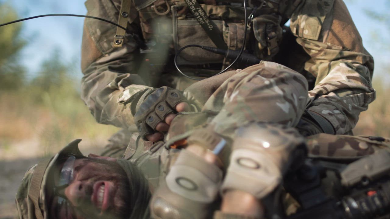 Saving a wounded soldier from the battlefield - Free Stock Video