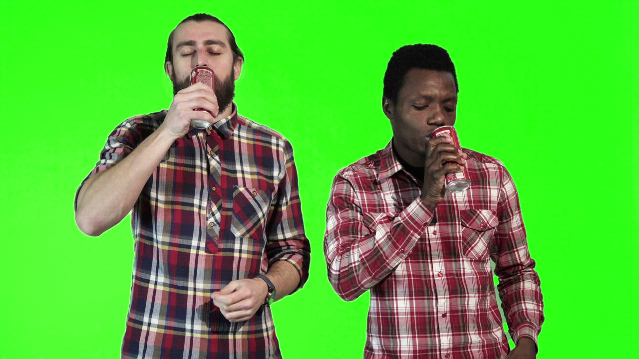Men drinking coke on a green screen - Free Stock Video