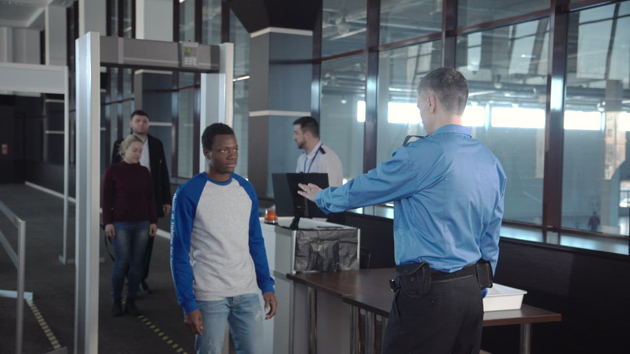 Passengers going through airport security - Free Stock Video