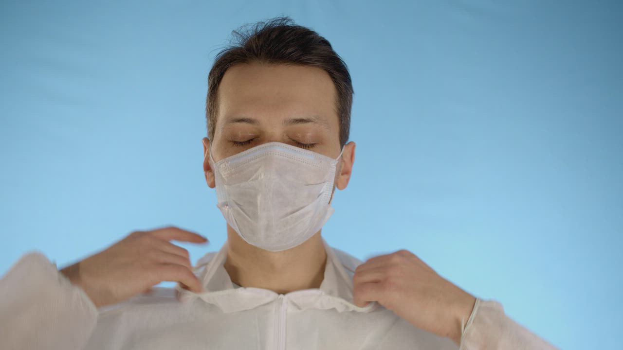 Man removing PPE - Free Stock Video
