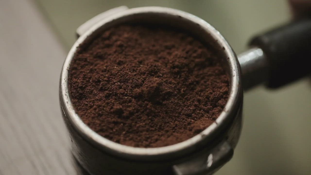 Pressing coffee before brewing - Free Stock Video