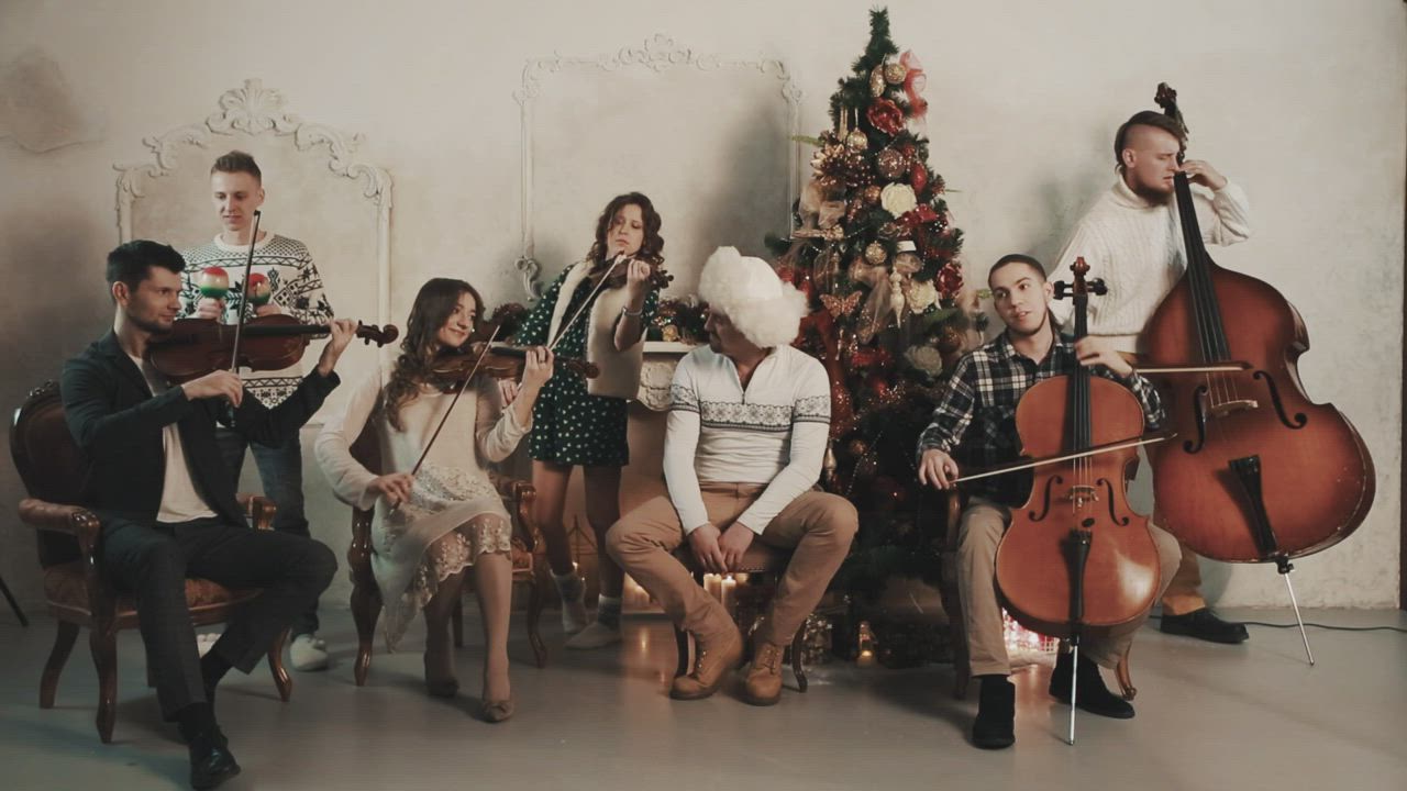 Festive band playing by a tree - Free Stock Video
