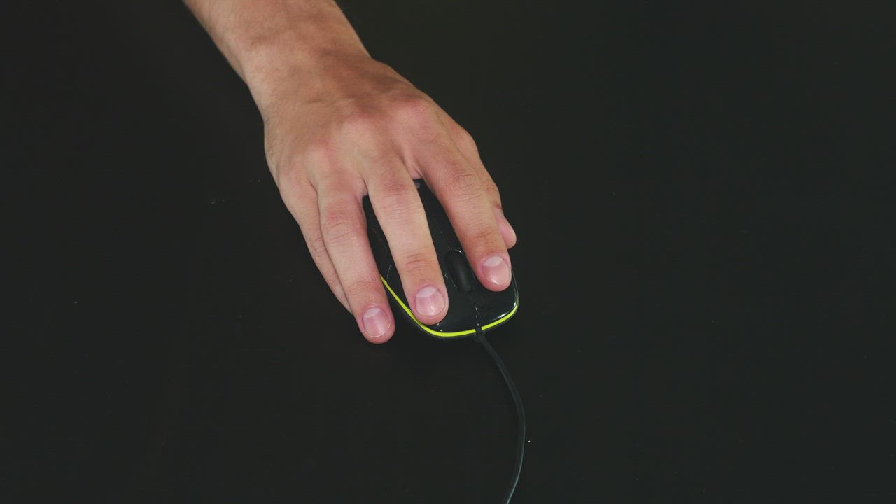 Clicking a mouse against a black background - Free Stock Video