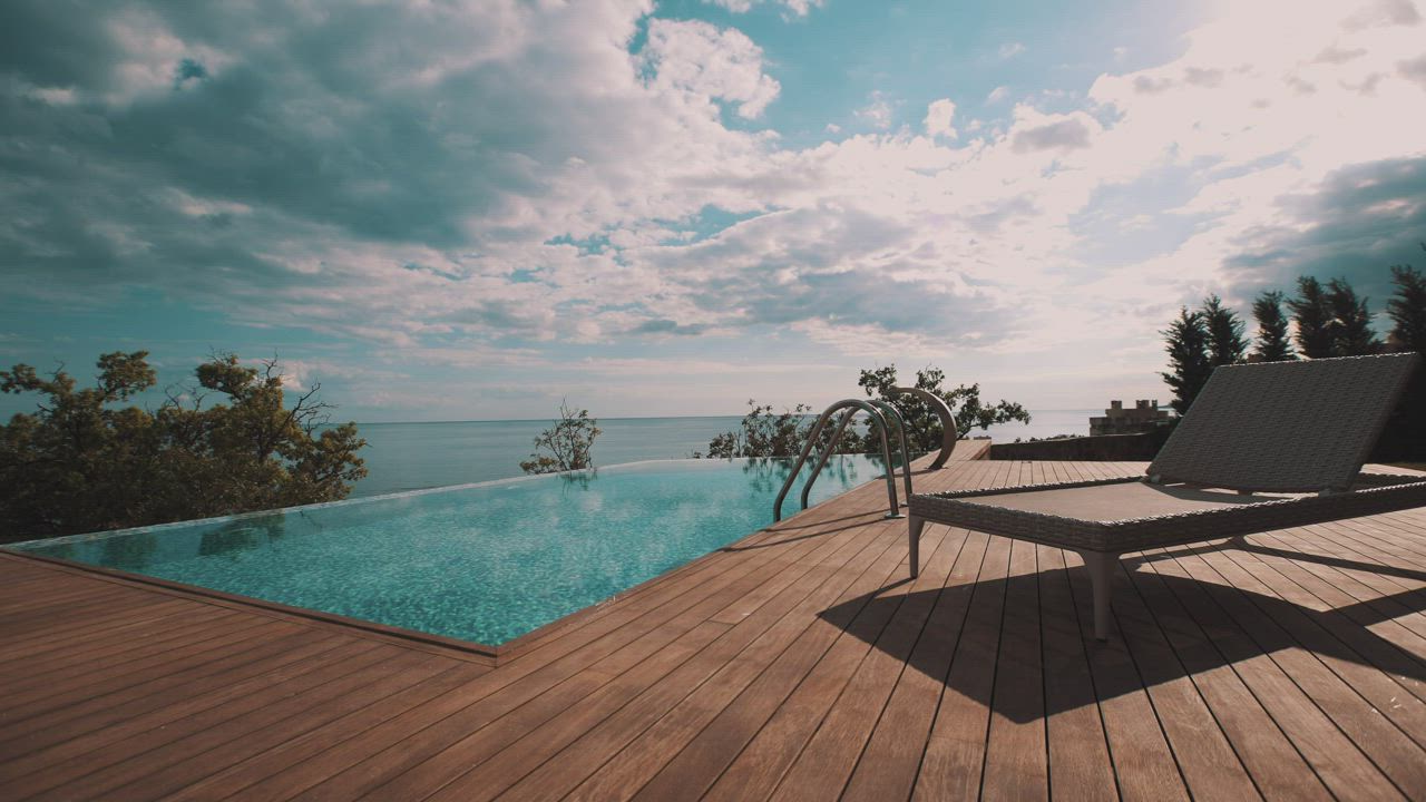 Infinity pool and wooden deck - Free Stock Video