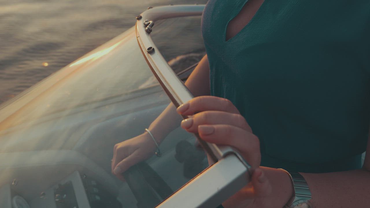 Girl driving a small boat - Free Stock Video