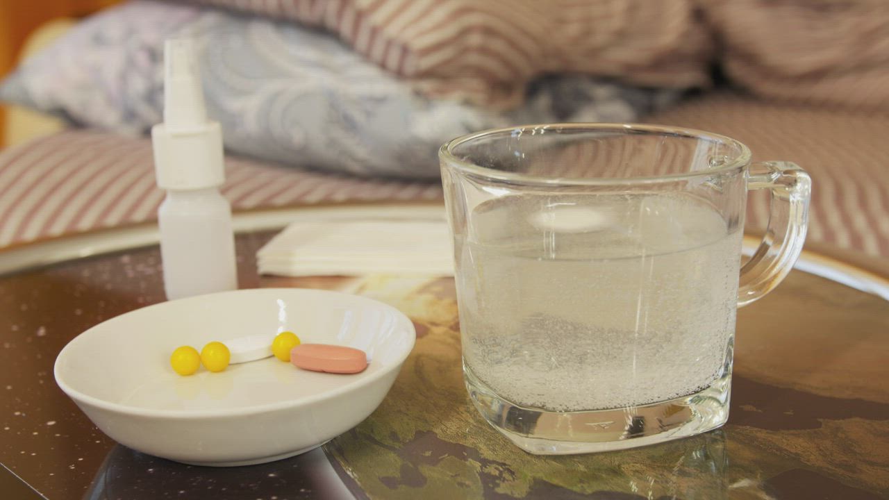 Taking cold and flu medication - Free Stock Video