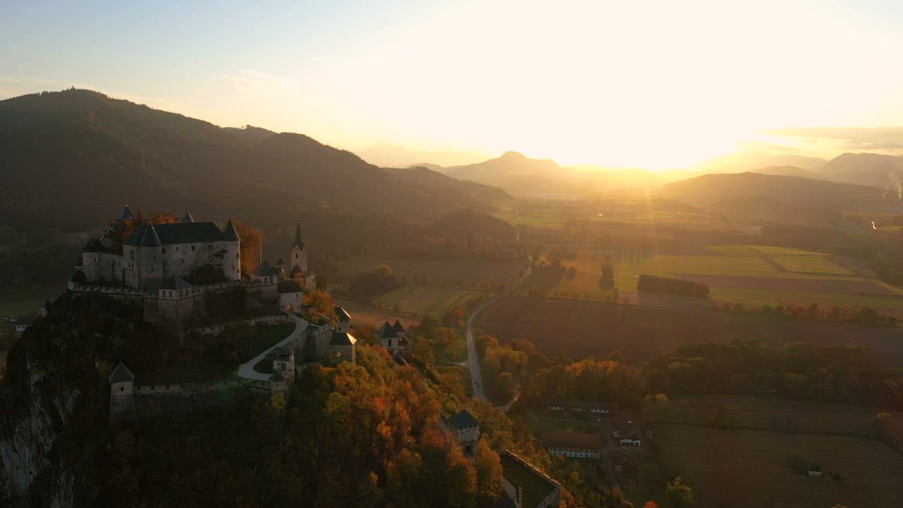 Medieval castle in the mountain at sunset - Free Stock Video