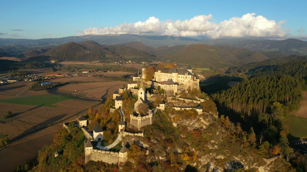 Aerial view of a medieval castle in the mountain - Free Stock Video