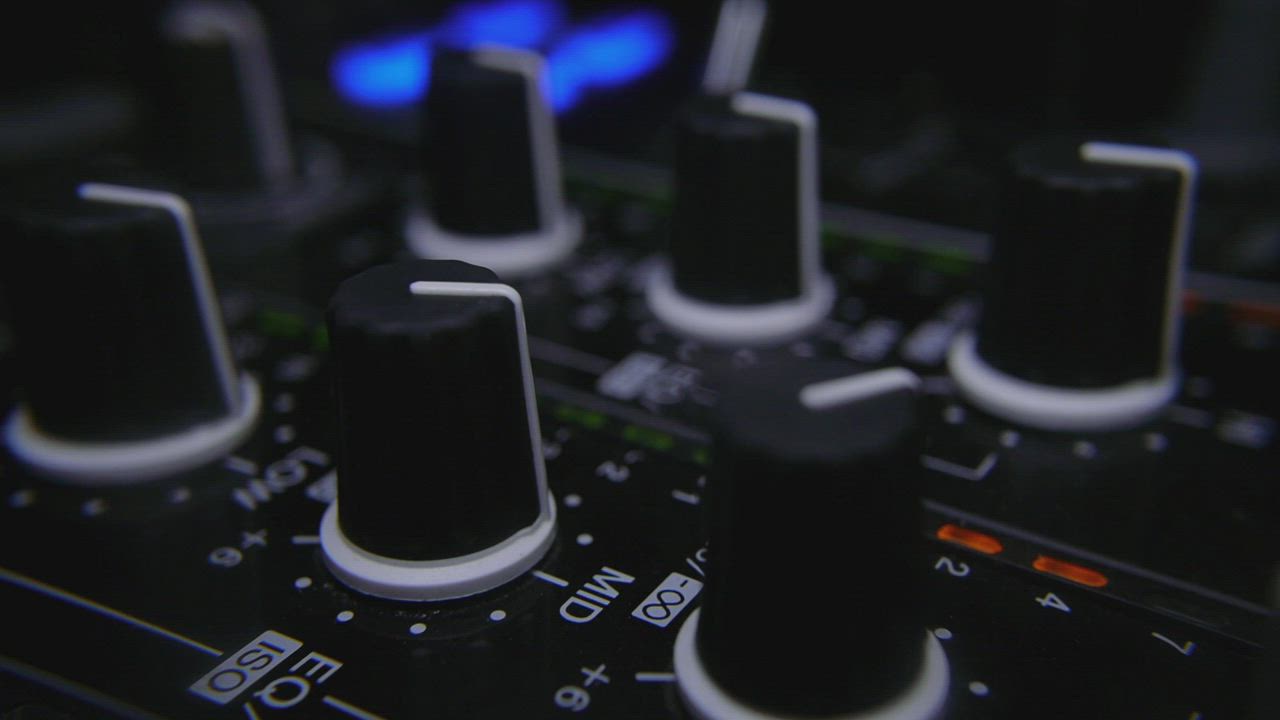 Adjusting knobs in mixer controller - Free Stock Video