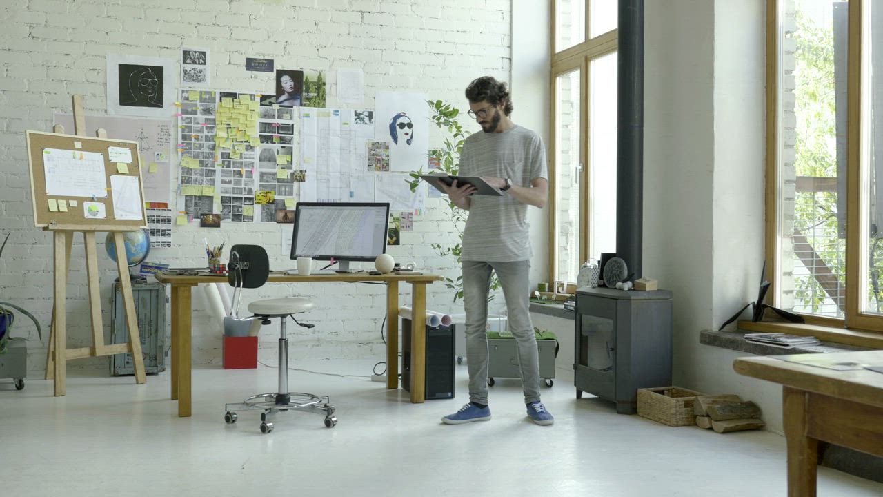 A man checking his notes in the studio - Free Stock Video