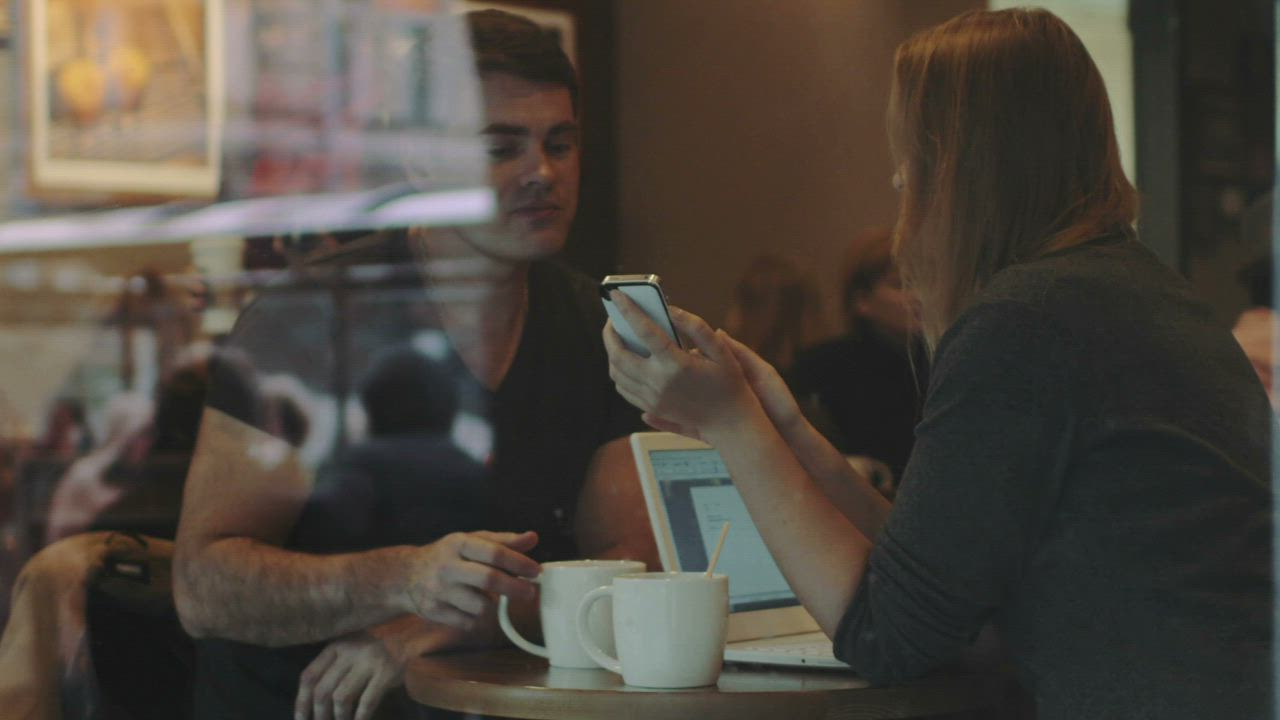 Friends chatting in a town coffee shop - Free Stock Video