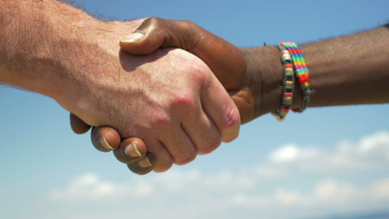 Two men shake hands outside - Free Stock Video