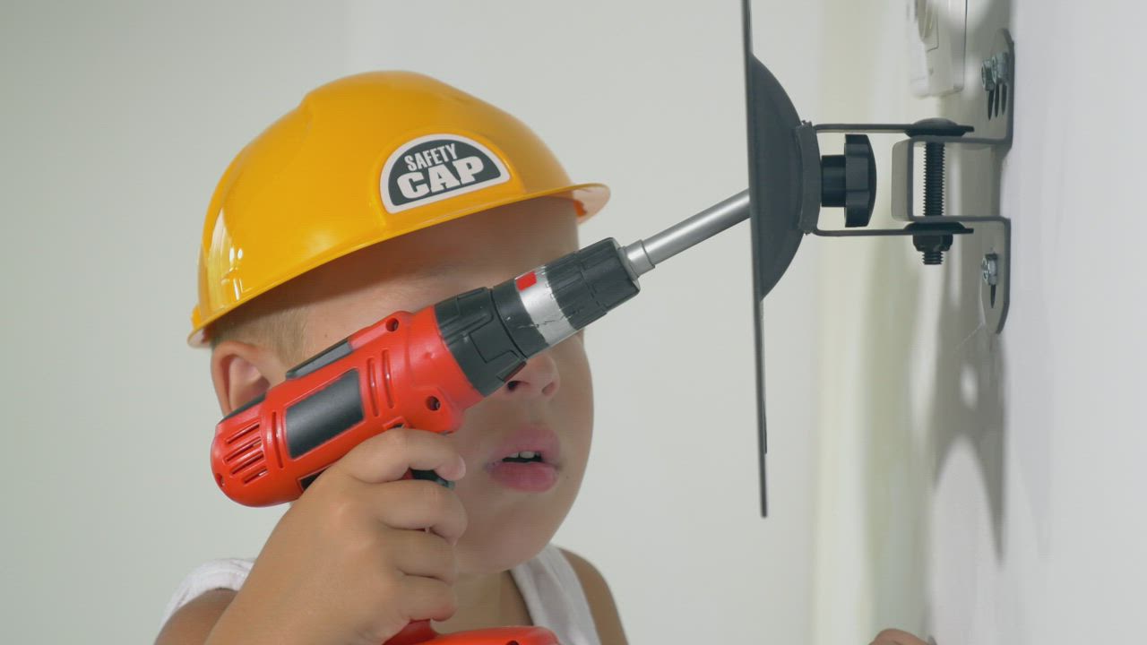 Boy playing with toy tools - Free Stock Video