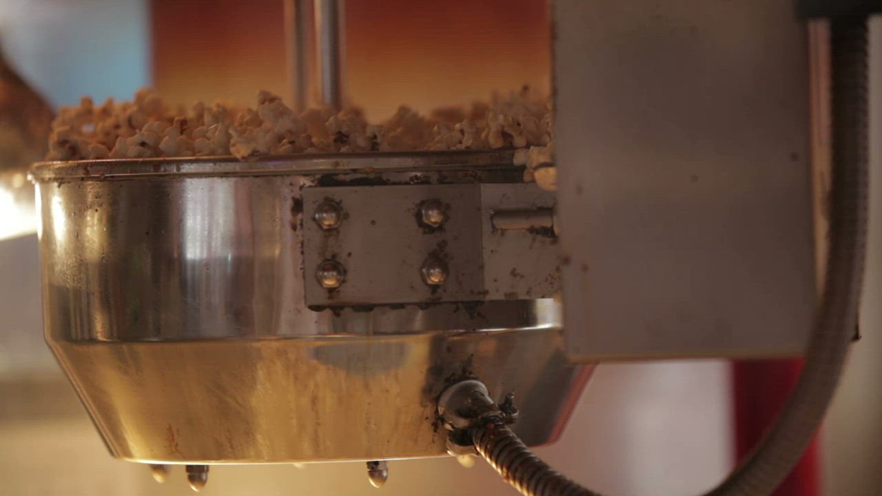 Making popcorn in a machine - Free Stock Video