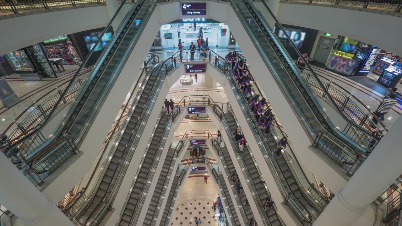 Shoppers walking through a mall - Free Stock Video