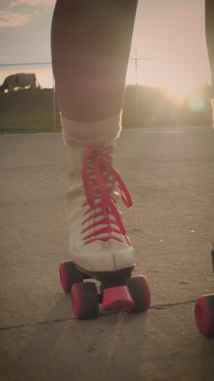 Roller skates of a girl when skating on the street - Free Stock Video