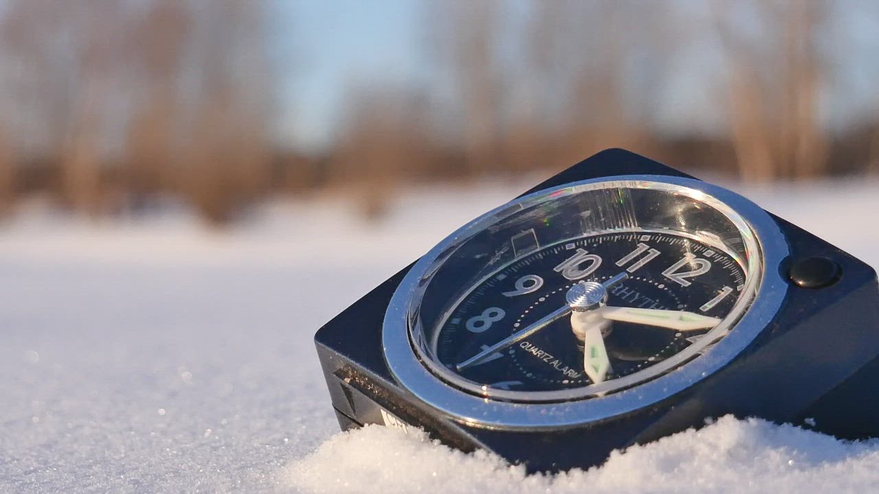 Alarm clock in the snow - Free Stock Video