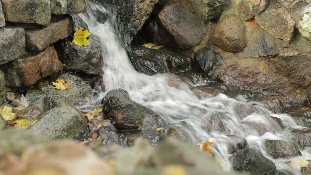 Water running through a wall - Free Stock Video