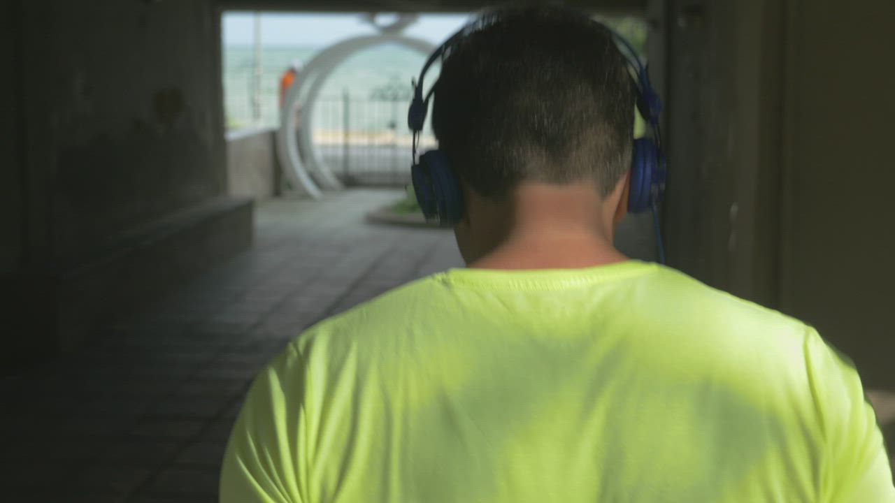 Man running through an urban building - Free Stock Video