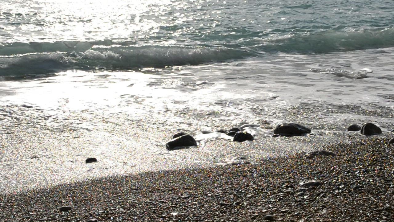 Silver waves breaking on the beach - Free Stock Video