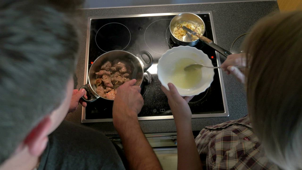 Couple preparing a meal together - Free Stock Video