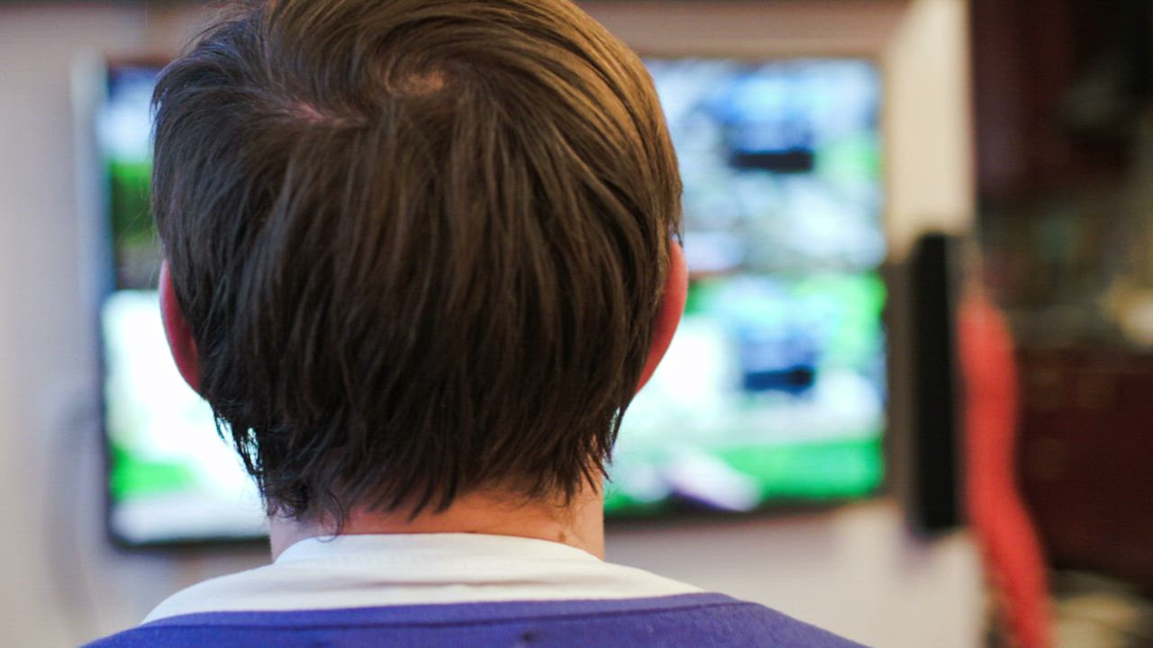 Playing a video game on TV - Free Stock Video