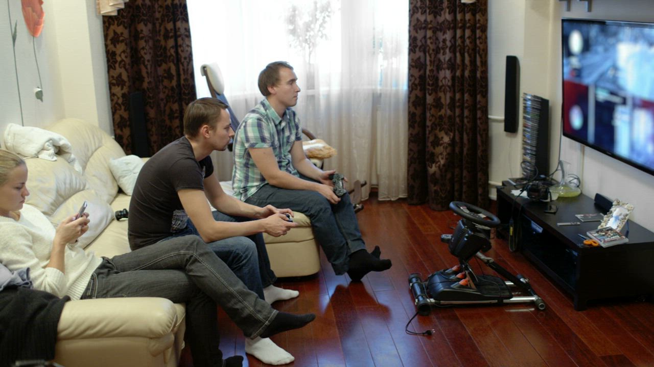 Friends playing a video game splitscreen - Free Stock Video